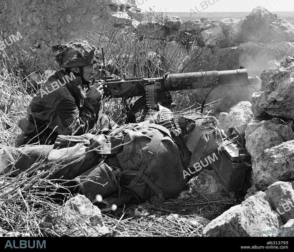 Vickers machine gun in action. It was a water-cooled 303 inch machine ...